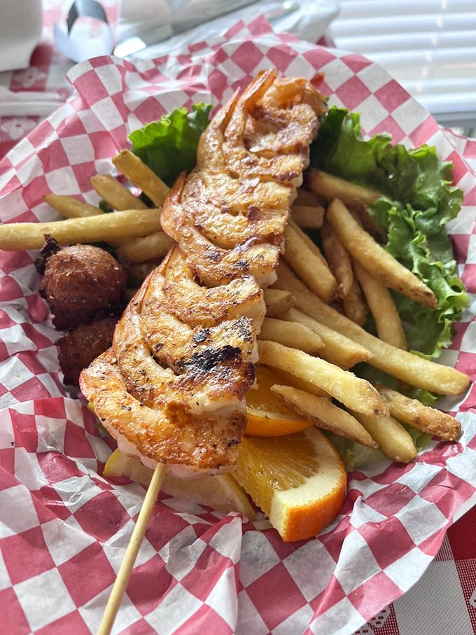 A skewer of perfectly grilled shrimp—nature's candy on a stick. The char marks are like flavor autographs from the grill master.