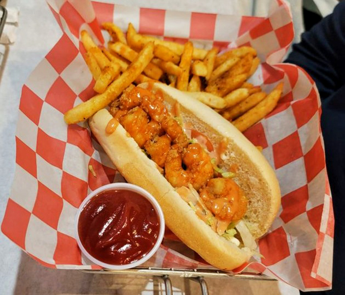 This shrimp po'boy isn't just a sandwich—it's a Southern handshake. Those golden fries are the perfect supporting cast.