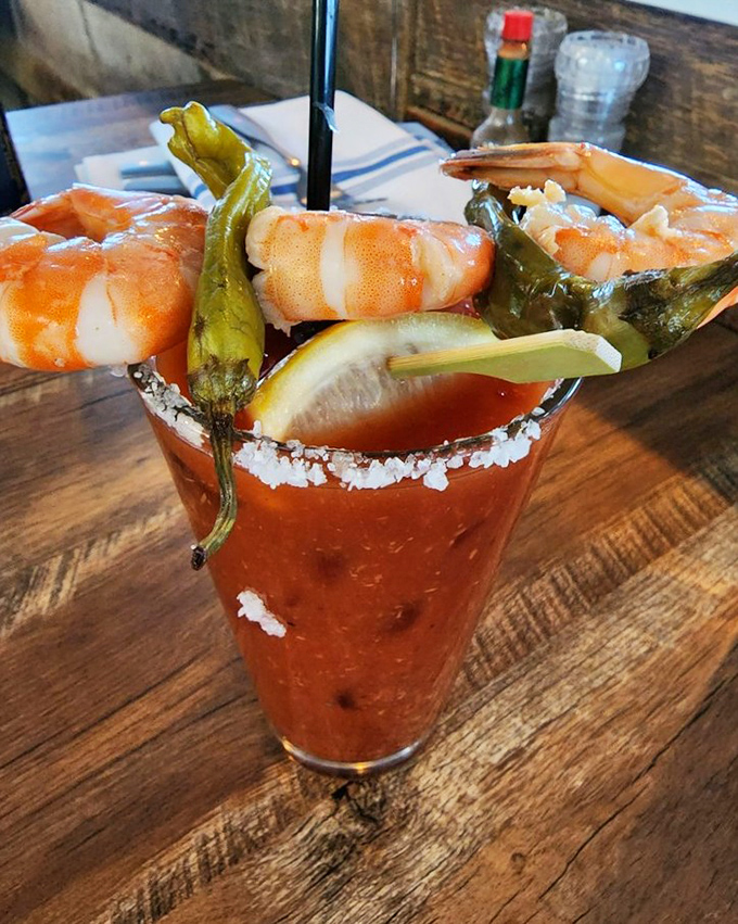 The Shrimply Mary – where cocktail meets appetizer in glorious harmony. Those roasted peppers and jumbo shrimp make this drink a meal in itself.