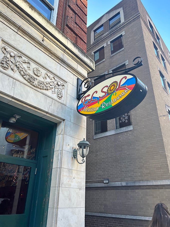 The sign hanging proudly against historic architecture—a colorful promise of culinary adventure just steps away from Harrisburg's bustling streets.