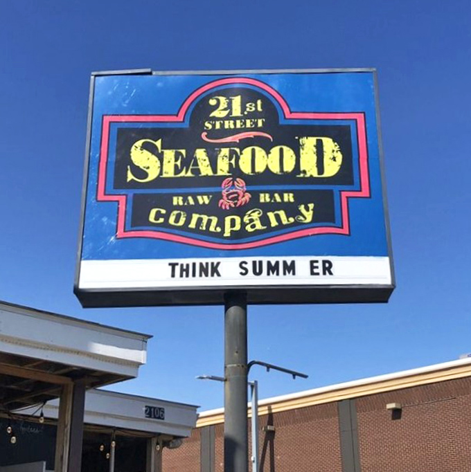 "Think Summer" says it all - this sign beckons seafood lovers to year-round coastal dining perfection.