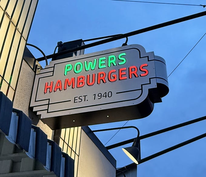 The vintage neon sign doesn't just advertise a restaurant; it announces an institution where Fort Wayne's burger traditions have been preserved since 1940.