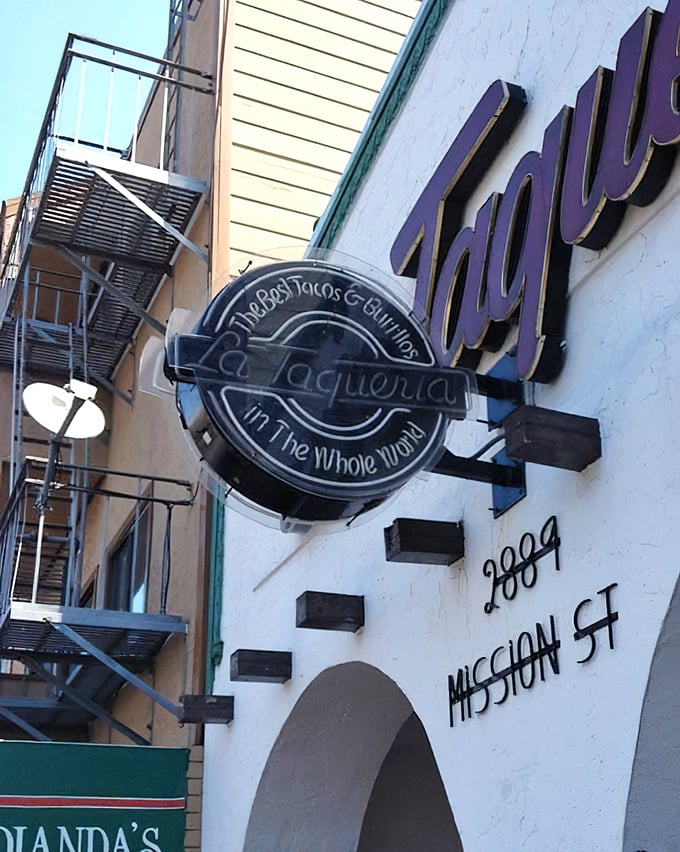 Bold signage promises "The Best Tacos & Burritos In The Whole World" with confident charm.