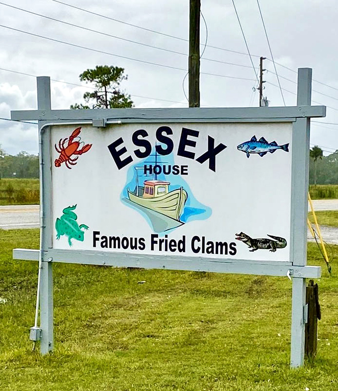 The roadside sign announces its specialty without apology – "Famous Fried Clams" isn't marketing; it's just stating facts.