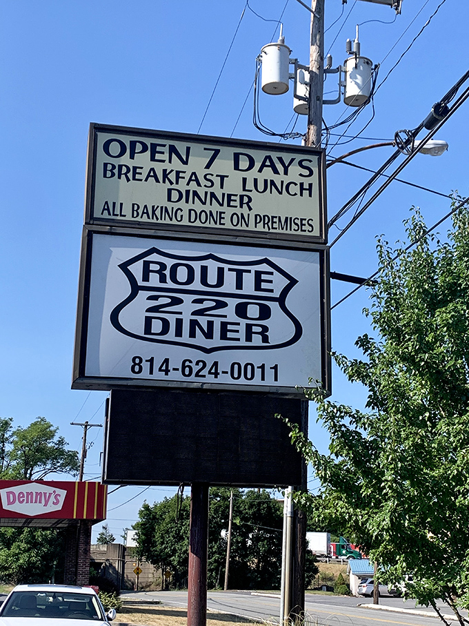 The roadside sign promises three daily opportunities for happiness – breakfast, lunch, and dinner, seven days a week.