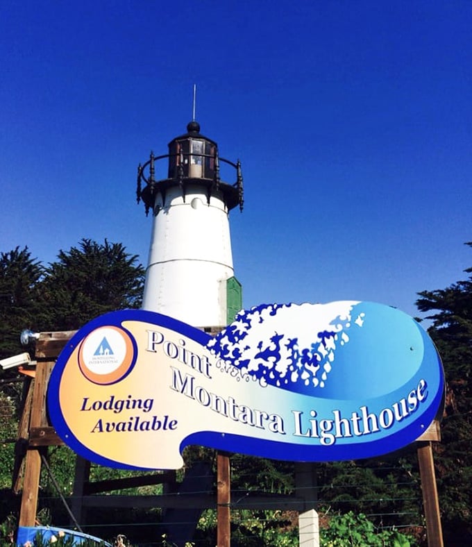The lighthouse stands brilliantly white against a perfect blue California sky. This beacon has guided ships since the 1800s and now guides travelers to unique accommodations.