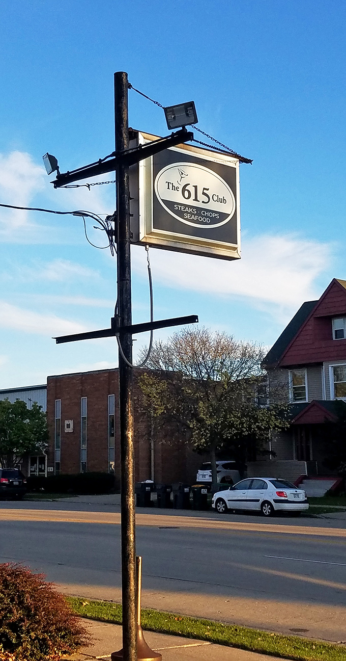 The sign stands tall against Wisconsin skies, a beacon for those seeking proper steaks, chops, and seafood in Beloit's dining landscape.