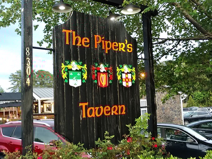 The sign stands sentinel in the parking lot, those colorful crests practically whispering, "Yes, you've finally found us. Come on in."