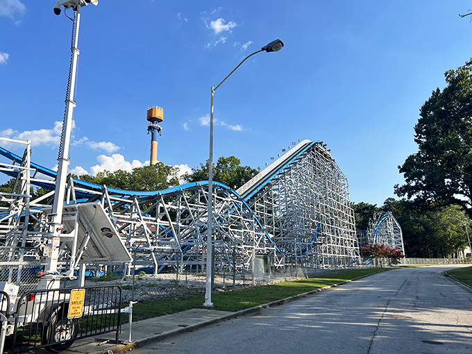 Six Flags' roller coaster silhouette against Georgia's blue sky promises thrills just minutes from Austell's peaceful streets – the best of both worlds.