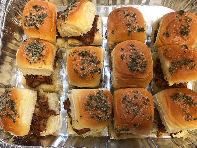 These sliders aren't just sandwiches—they're tiny ambassadors of joy, topped with herbs and ready to disappear in two bites flat.