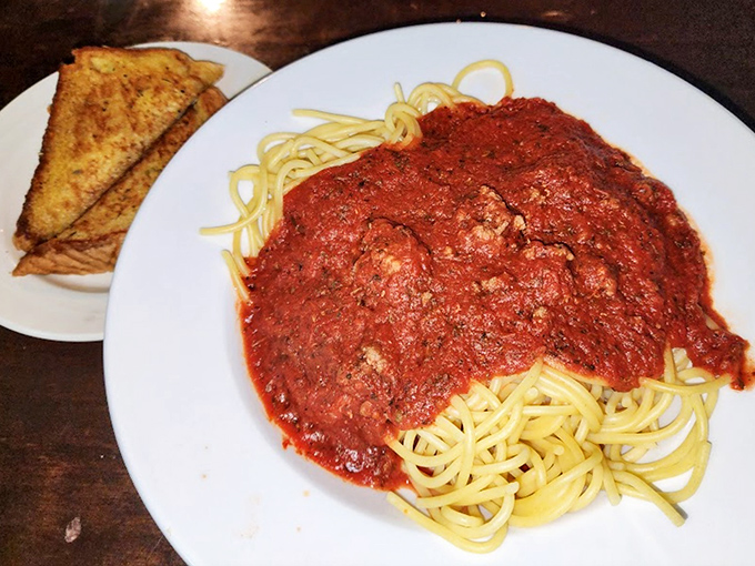 Spaghetti with meat sauce like your Italian grandmother would make—if your grandmother believed in generous portions and garlic bread on the side.