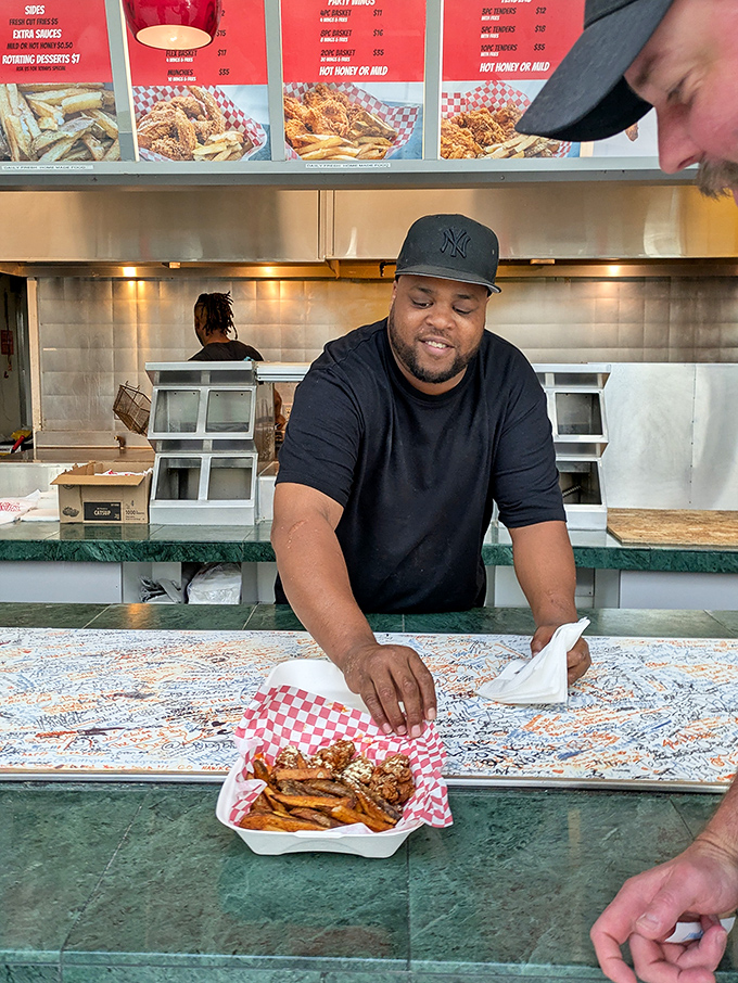 Crafting each order with care and precision—this isn't just cooking, it's chicken artistry in motion.