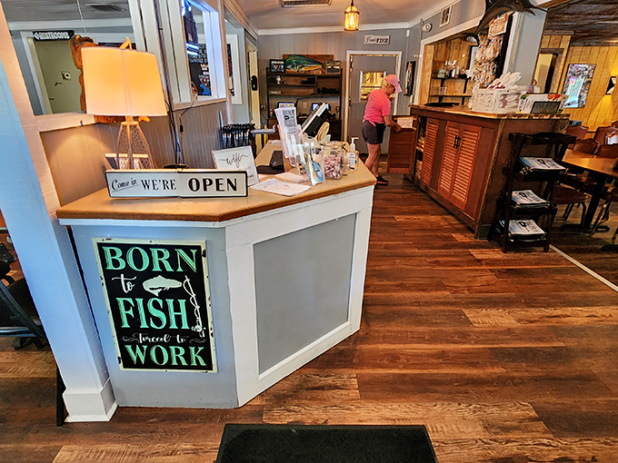 The "Born to Fish, Forced to Work" sign at the host stand perfectly captures the spirit of a place where seafood isn't just food—it's a calling.