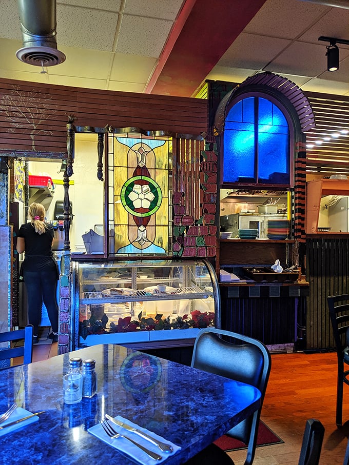 The interior's exposed ductwork and colorful design elements create an atmosphere that's equal parts industrial chic and artistic whimsy—just like the food.