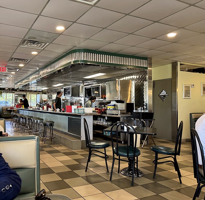 Where diner magic happens—the open kitchen where cooks transform simple ingredients into the comfort food that keeps us coming back.
