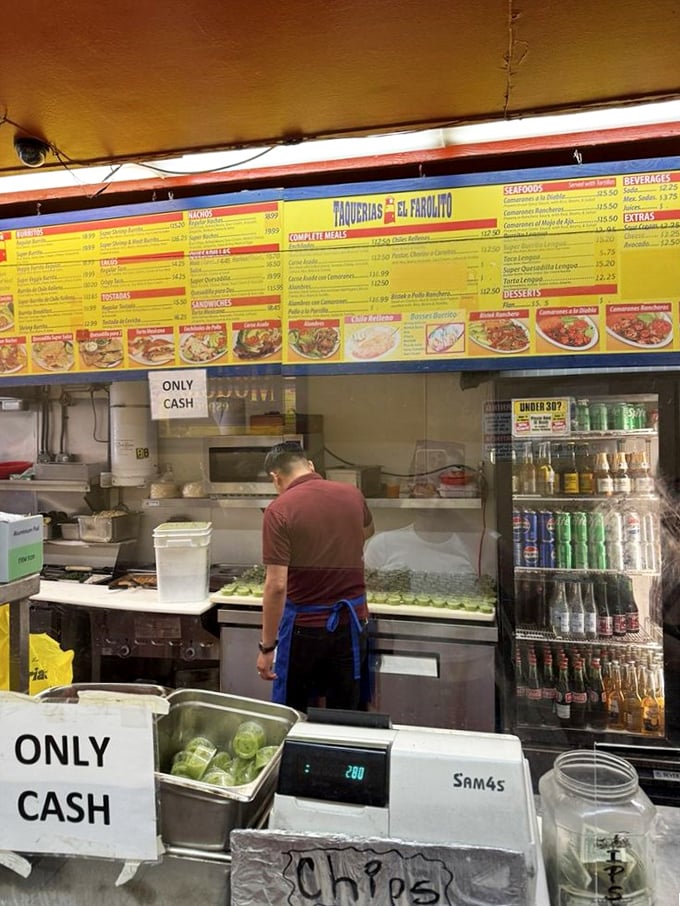Behind the counter, culinary magic happens with practiced efficiency – no wasted movements when there are hungry masses to feed.