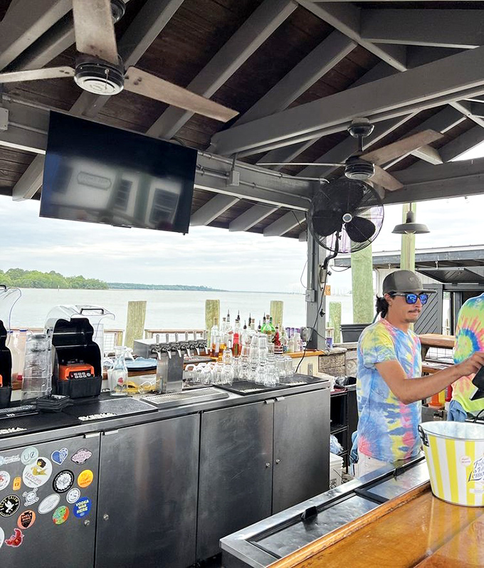 Where the magic happens – an outdoor bar with water views that could make any cocktail taste better. The tie-dye shirt is just a bonus.