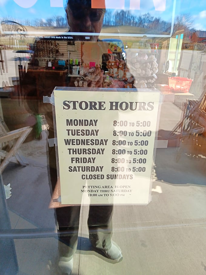 The store hours sign: a gentle reminder that even paradise has boundaries. Plan accordingly or face the consequences of a treatless Tuesday evening.