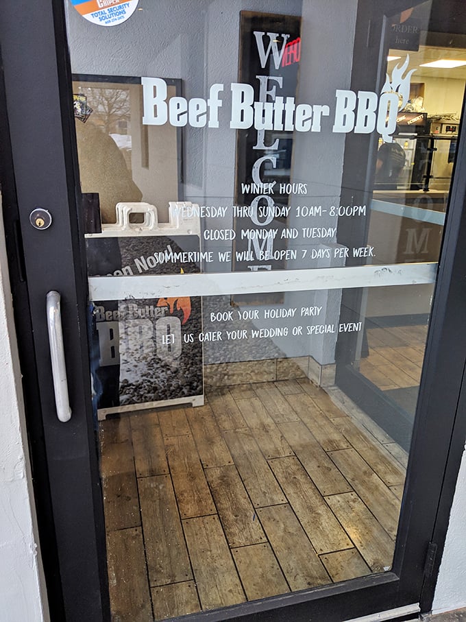 Winter hours posted clearly – because even in Wisconsin's frozen months, the primal need for proper BBQ doesn't hibernate.