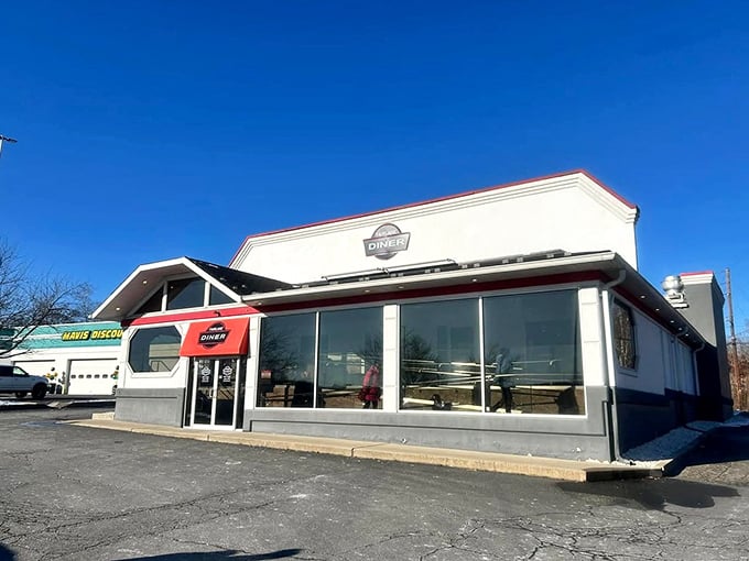Morning light catches the classic diner profile, beckoning hungry travelers like a lighthouse guides ships to safe harbor.