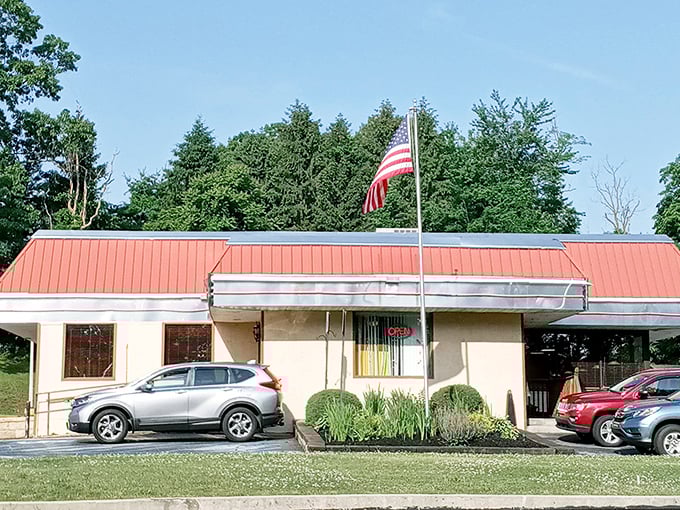 An American flag flies proudly outside—because nothing says "patriotism" quite like a place that serves breakfast all day.