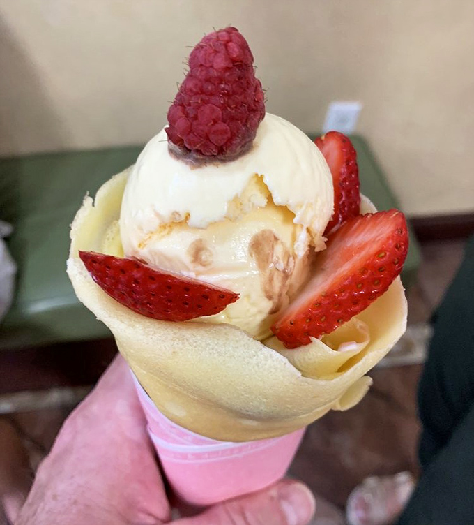 A crepe cradles ice cream and berries like they're precious cargo. In this edible envelope, the message is always "delicious."