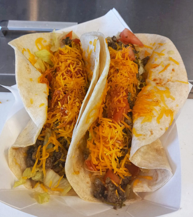 These aren't just tacos; they're handheld happiness topped with a snowfall of cheese that makes Tuesday special any day of the week.