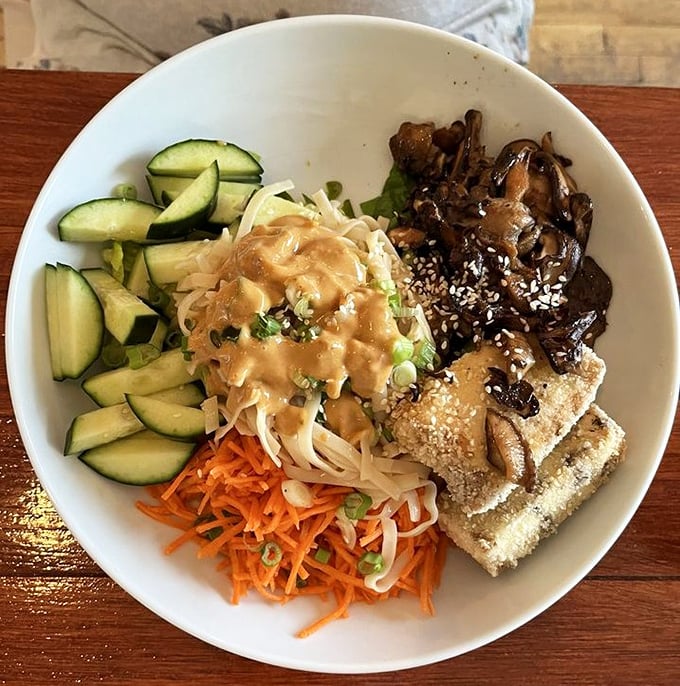 A bowl that tells a global story: crisp vegetables, savory protein, and a sauce that ties everything together like a well-written final chapter.
