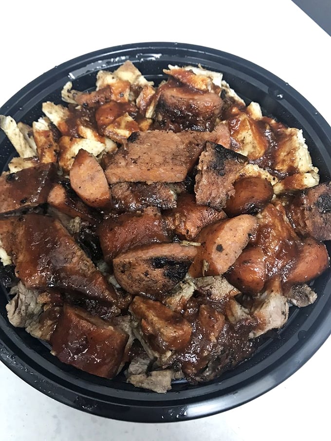 This three-meat bowl is what happens when barbecue decides to get efficient – all the smoky goodness stacked together for maximum flavor in every bite.