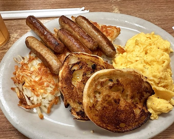 The breakfast platter that says "You won't need lunch today." Those pancakes aren't just golden discs—they're edible sunshine on a plate of morning perfection.