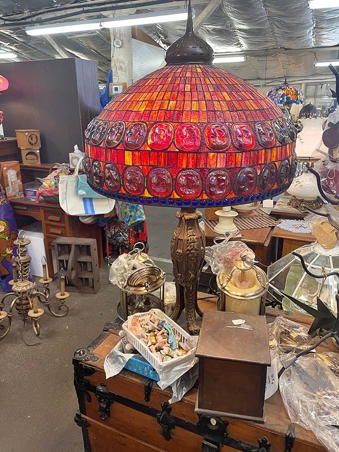 This Tiffany-style lamp glows like a sunset among the antique treasures. One person's attic castoff becomes another's conversation-starting masterpiece.