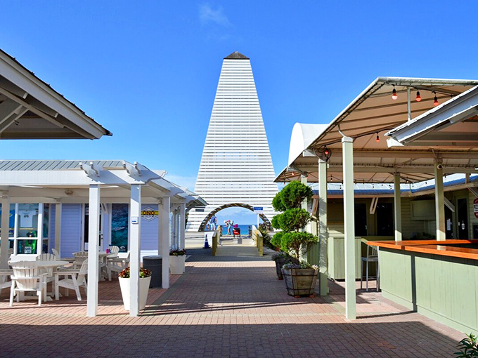 Seaside's iconic white tower serves as both landmark and Instagram backdrop. Like a lighthouse for shoppers instead of sailors.