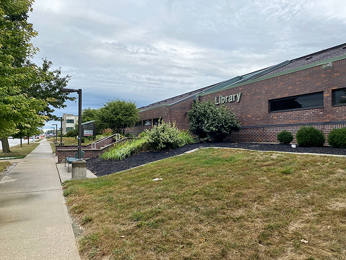 The Troy-Miami County Public Library welcomes knowledge-seekers with its understated brick façade and carefully maintained landscaping.