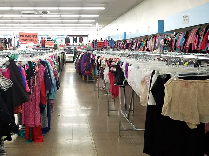 Racks of colorful garments create a textile rainbow—each hanger holding possibilities for wardrobe reinvention without the retail markup.