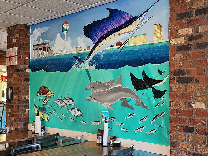That mural brings the Gulf right inside – dolphins, marlins, and the promise of fresh catches.