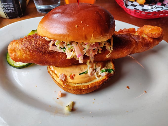 This isn't just a fish sandwich—it's Lake Superior's finest catch dressed for a special occasion with slaw and a golden-fried coat.