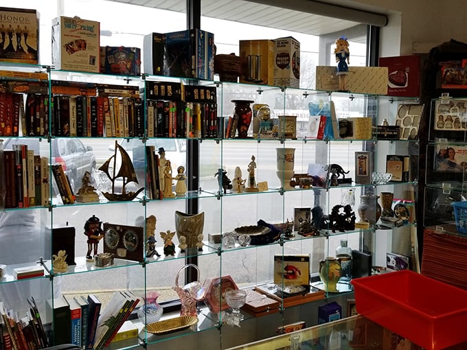 Curated collectibles behind glass—one person's past treasures becoming another's conversation pieces. Those figurines have stories we'll never know.