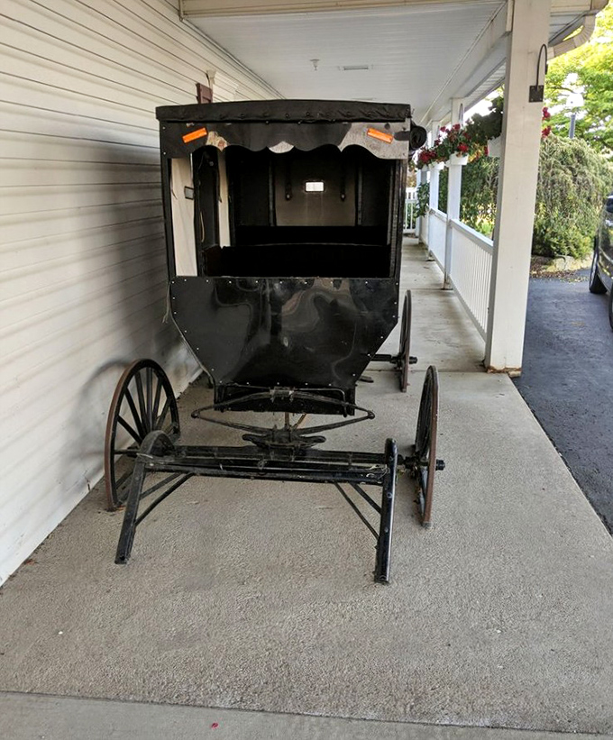 An authentic Amish buggy stands sentinel by the entrance—a reminder that some traditions are worth preserving, like scratch-made cooking.