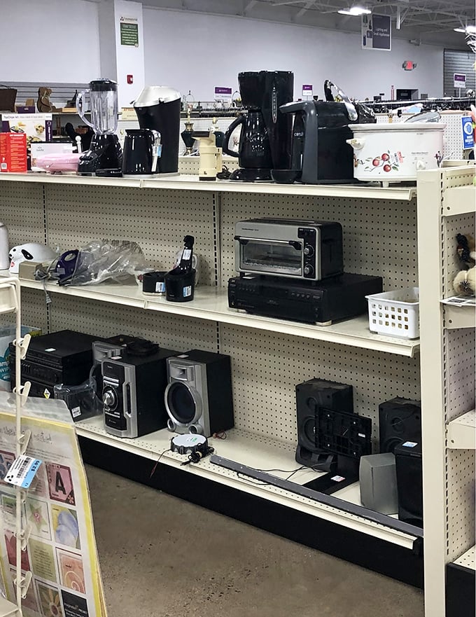 Coffee makers, toasters, and sound systems line these shelves—all tested and working, ready to outfit your kitchen or dorm room without breaking the bank.
