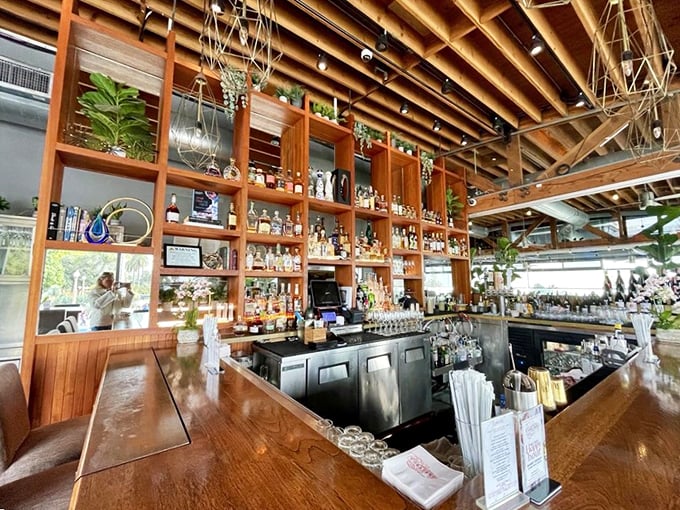 A bar that doesn't just serve drinks—it showcases bottles like trophies and promises conversations as smooth as its top-shelf spirits.