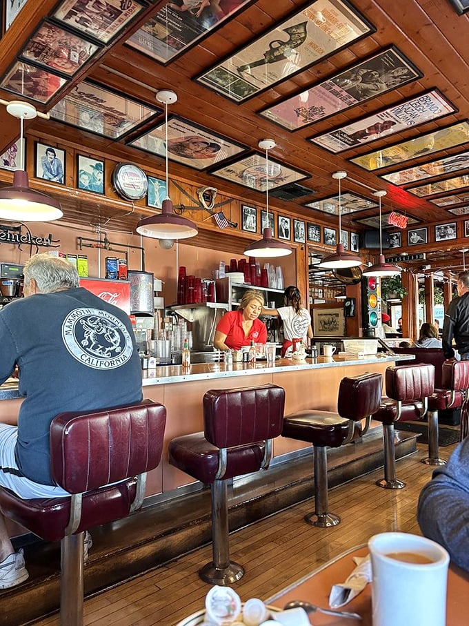 The counter seating – where solo diners become regulars and the coffee keeps flowing as freely as the conversation.