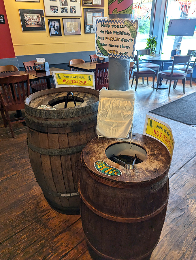 The legendary pickle barrels—help yourself, but as the sign wisely warns, restraint is appreciated. These aren't your average cucumber transformations.