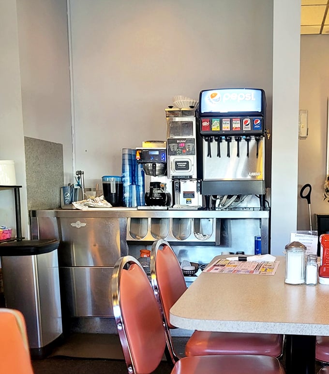 The beverage station stands ready like a caffeinated command center, prepared to fuel conversations and wake up taste buds.