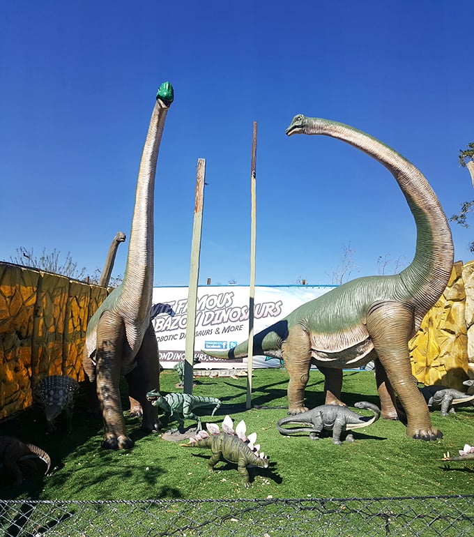 Long-necked giants reach for the sky, surrounded by their smaller dinosaur companions in this whimsical prehistoric family reunion.