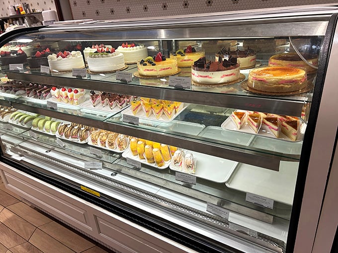 The cake case—where celebration meets art. These aren't just desserts; they're edible time machines to childhood birthday parties and special occasions.
