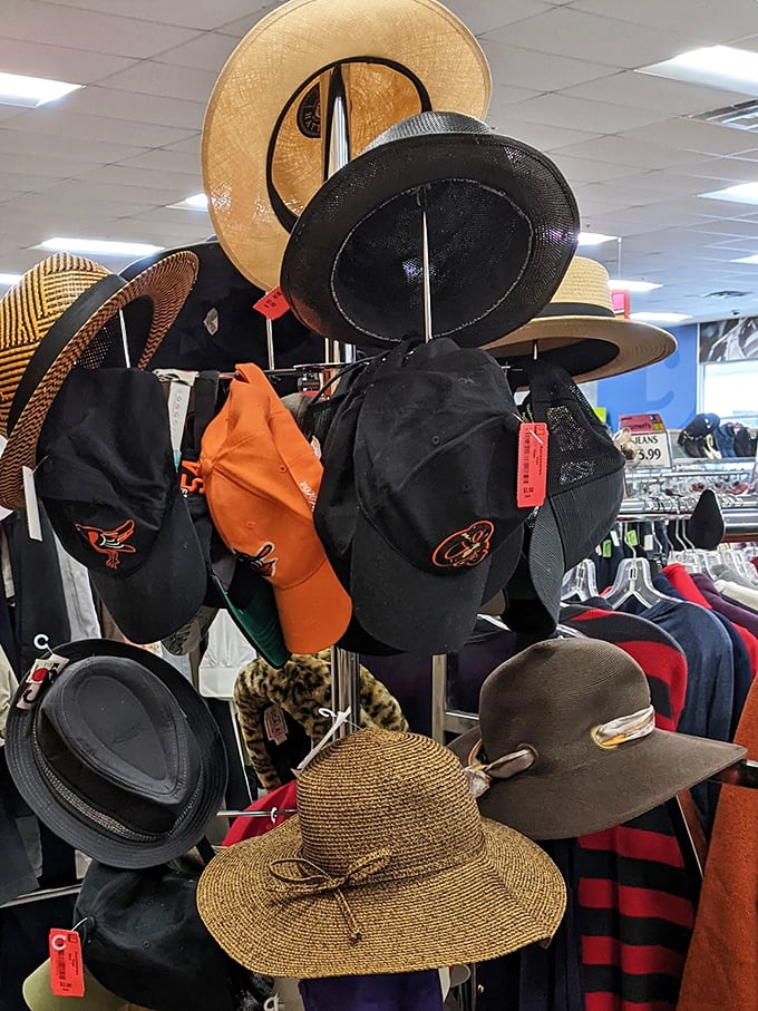 Hat paradise where Orioles caps mingle with fancy derby headwear. Your next signature look is hiding somewhere in this fashionable forest.
