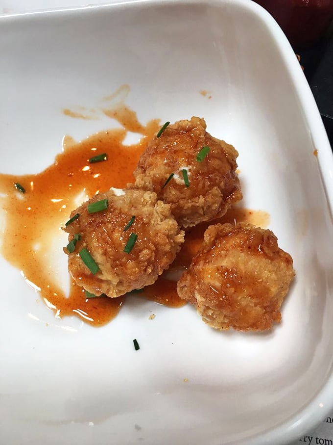 These golden spheres of fried goodness aren't just appetizers—they're little orbs of joy that make you forget about your diet resolutions.