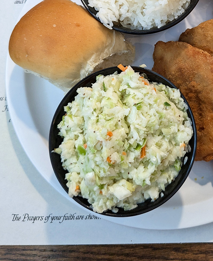 This isn't just coleslaw—it's a crisp, tangy counterpoint to the region's hearty fare, bringing balance to the culinary force.
