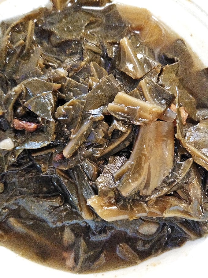These aren't just collard greens—they're a slow-simmered Southern poem, telling stories of tradition with each tender, savory bite.