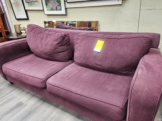 This plum-colored sofa isn't just furniture—it's a mood. Its rich hue and plush cushions invite you to sink in with a good book and completely forget about your to-do list.